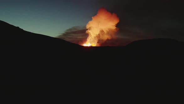 An Unveiling Shot Of An Blasting Volcano Against Dark Skies, Stock Footage