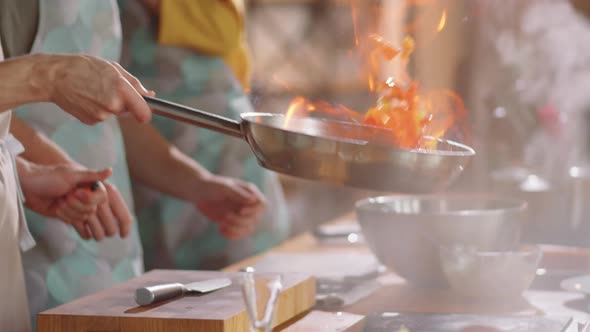 Chef Cooking Flambe Dish during Culinary Master Class, Stock Footage