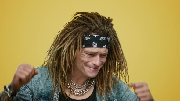 Happy Rocker Dancing on Yellow Background, Stock Footage | VideoHive