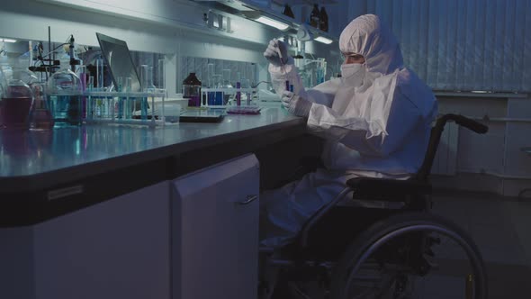 Disabled Female Scientist in Wheelchair Doing Research, Stock Footage