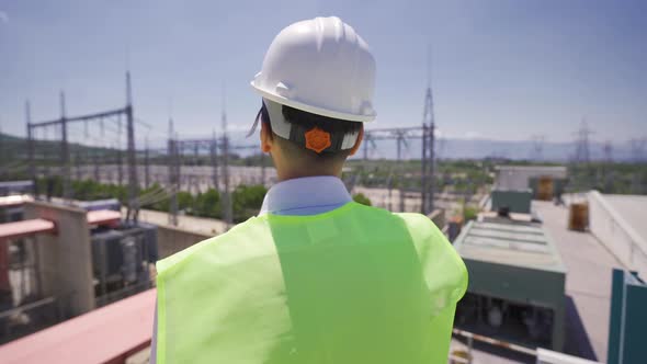Engineer speaking by radio at power station., Stock Footage | VideoHive