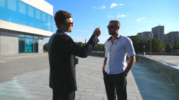 Two Business Men Standing Outdoor Near Office and Talking. Businessmen ...