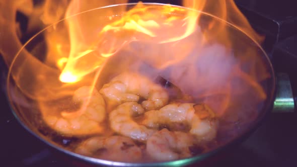 Cooking flambe shrimps in pan, Stock Footage | VideoHive