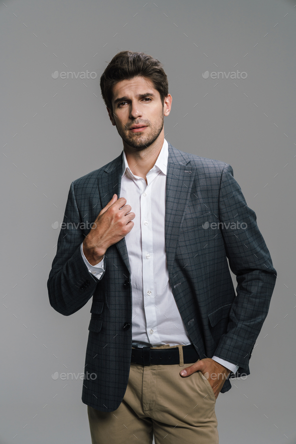 Photo of respectable confident businessman posing and looking at camera ...