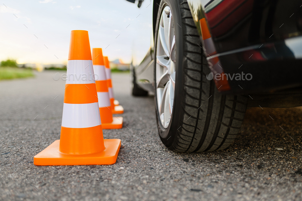 Car and traffic cones, driving school concept Stock Photo by NomadSoul1