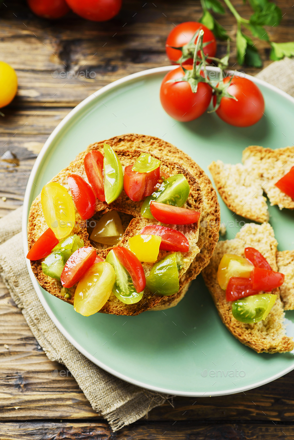 Traditional italian bread frisella with tomatos Stock Photo by ...