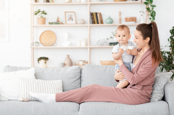 Happiness Of Motherhood. Young Woman EnjoyingTime With Her Baby At Home ...