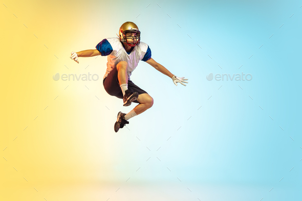 American football player isolated on gradient studio background in neon ...