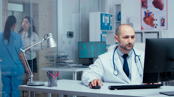 Medical staff working in modern private clinic Stock Photo by DC_Studio