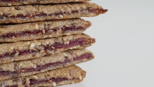 Raspberry energy bars with assorted cereals close-up 4K 2160p 30fps ...