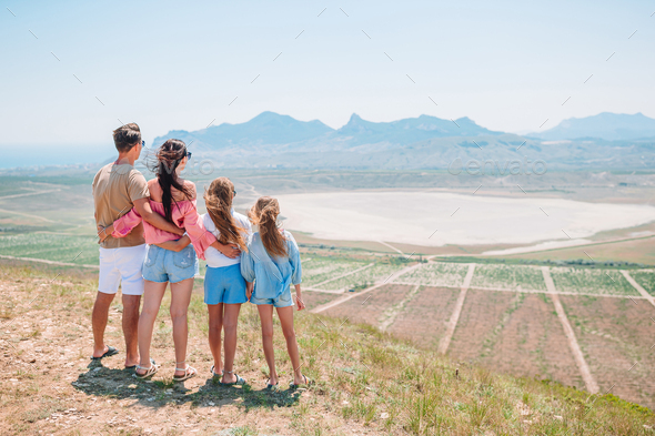Happy family on vacation in the mountains Stock Photo by travnikovstudio
