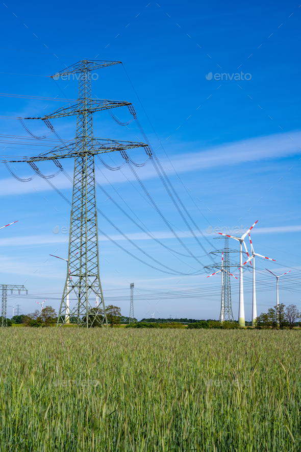 Overhead power lines and wind turbines Stock Photo by elxeneize | PhotoDune