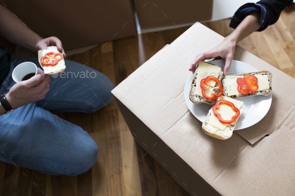 High angle view of people eating sandwiches Stock Photo by astrakanimages