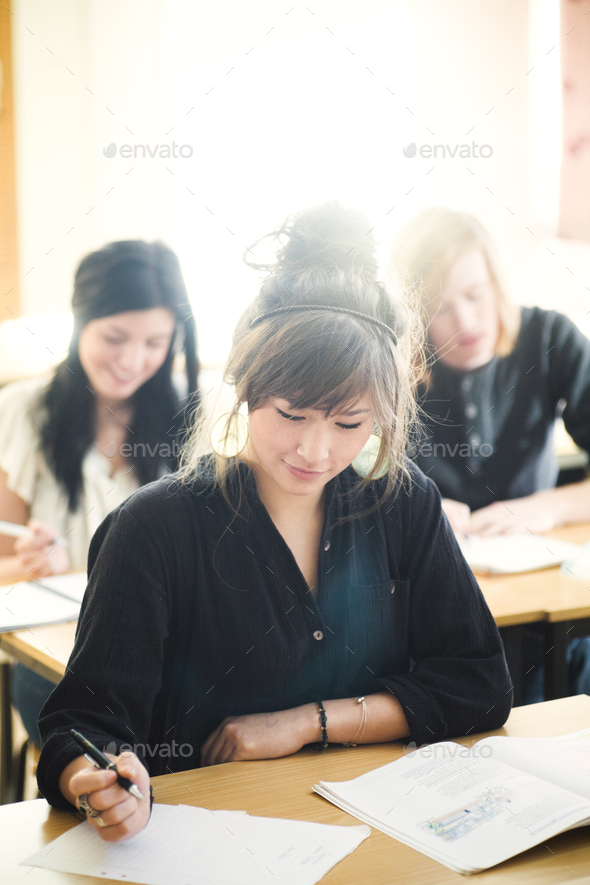 High school students studying in classroom Stock Photo by astrakanimages