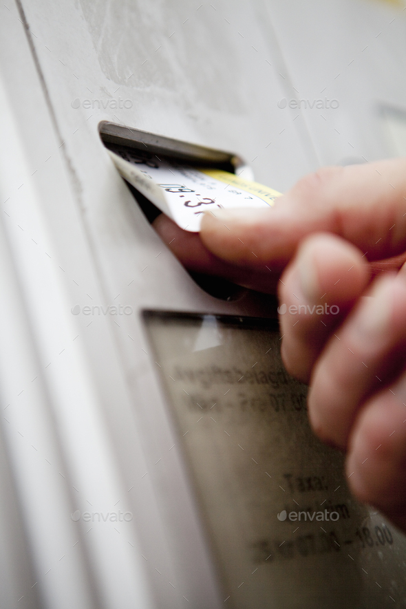 Close-up of hand pulling ticket from machine at railroad station Stock ...