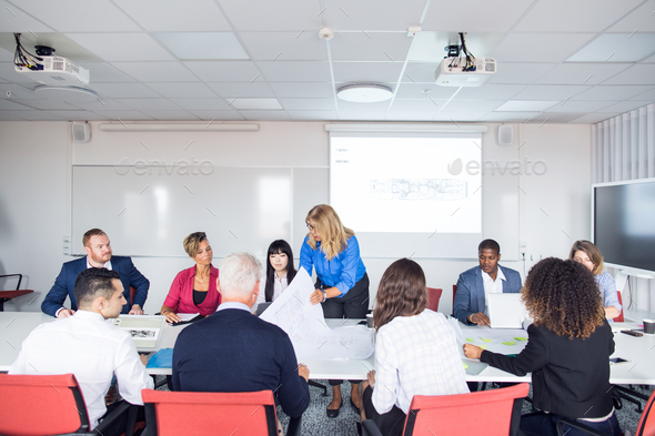 Team of architects and project managers meeting in office Stock Photo ...