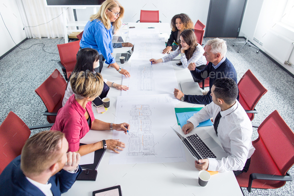 Team of architects and project managers working in office Stock Photo ...