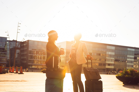 Businesswomen talking on sunny day Stock Photo by astrakanimages ...
