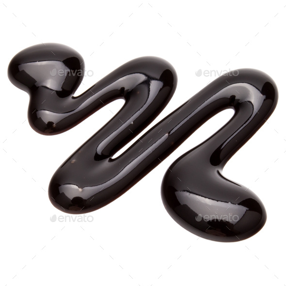 Chocolate syrup drop isolated on white background Stock Photo by natika