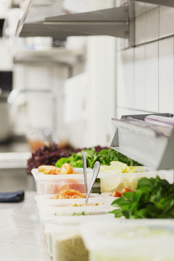 Lebanese food on commercial kitchen counter Stock Photo by astrakanimages