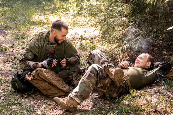 Young soldiers resting in shelter Stock Photo by Pressmaster | PhotoDune