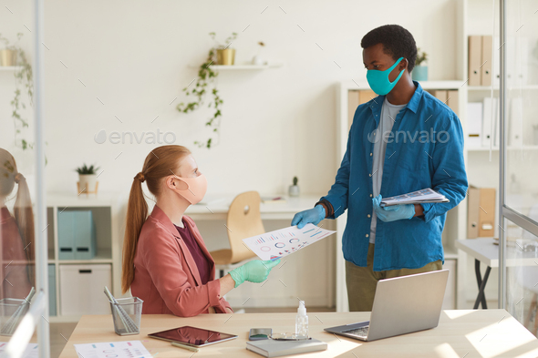 Workers Wearing PPE in Office Stock Photo by seventyfourimages | PhotoDune