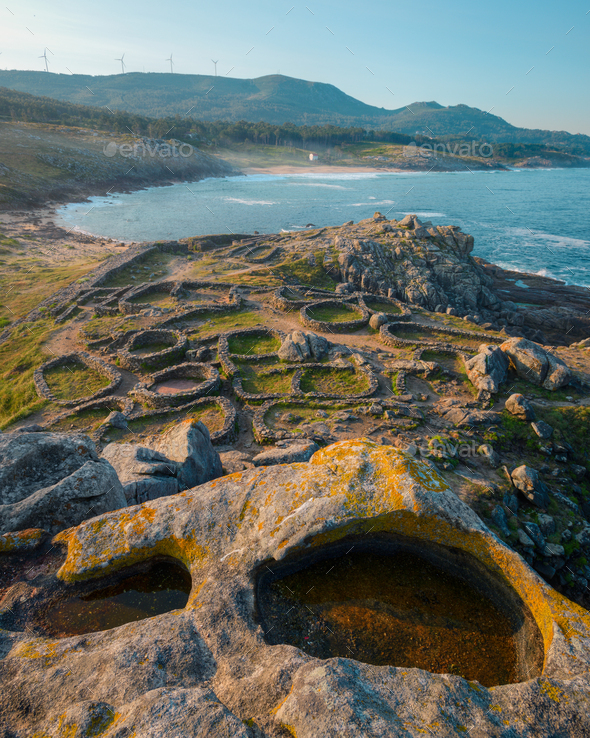 Circular structures of Celtic buildings Stock Photo by luisvilanova