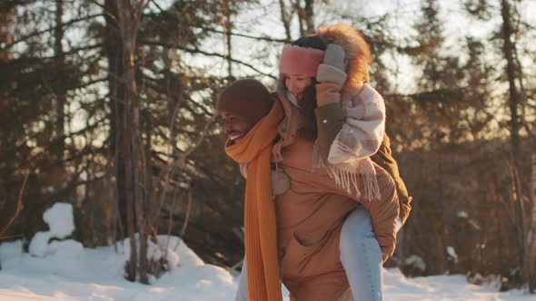 Woman Riding On Man Shoulders In Winter, Stock Footage | VideoHive