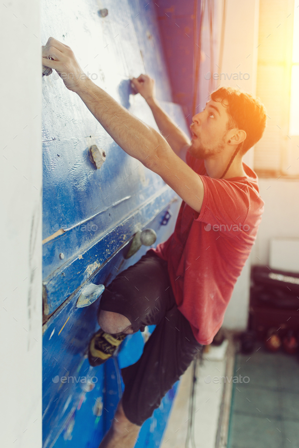 Fit man rock climbing Stock Photo by diignat | PhotoDune