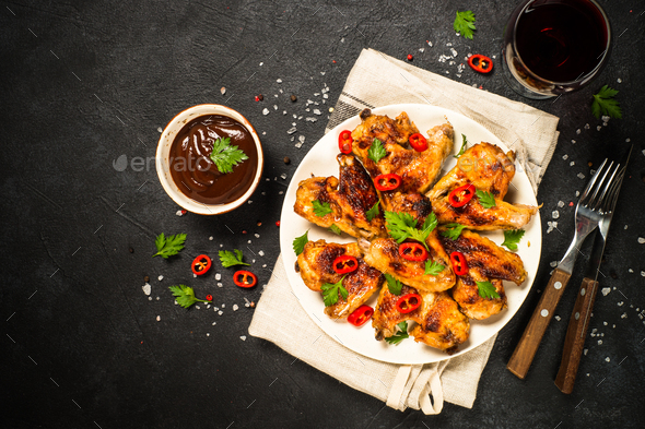 Grilled chicken wings at black Stock Photo by Nadianb | PhotoDune