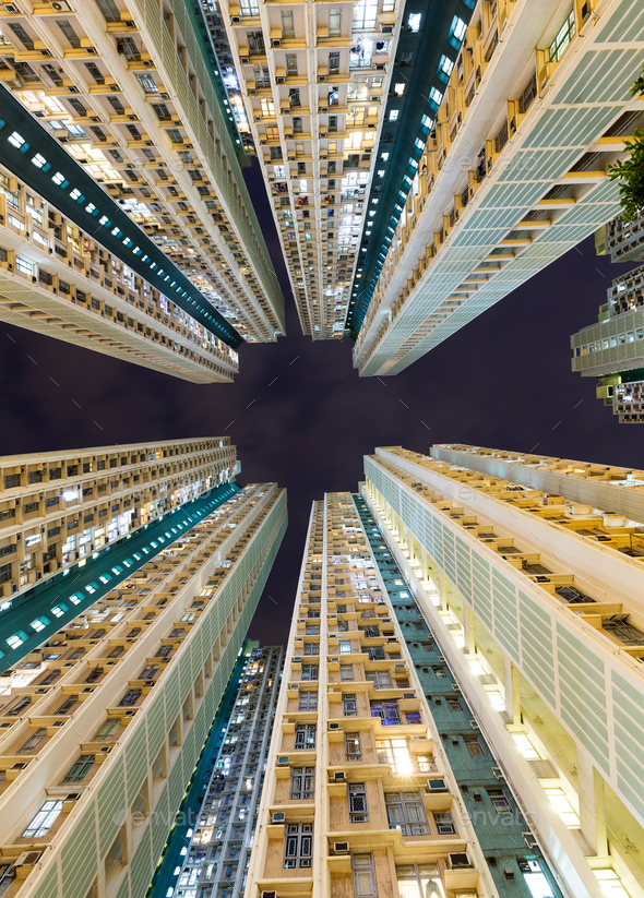 Residential building to the sky at night Stock Photo by leungchopan