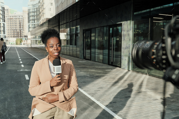 News reporter outdoors Stock Photo by AnnaStills | PhotoDune