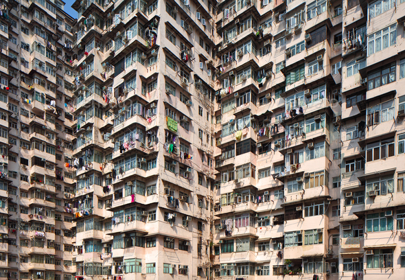 Overcrowded residential building in Hong Kong Stock Photo by leungchopan