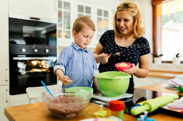 Child helping mother bake cookies Stock Photo by nd3000 | PhotoDune