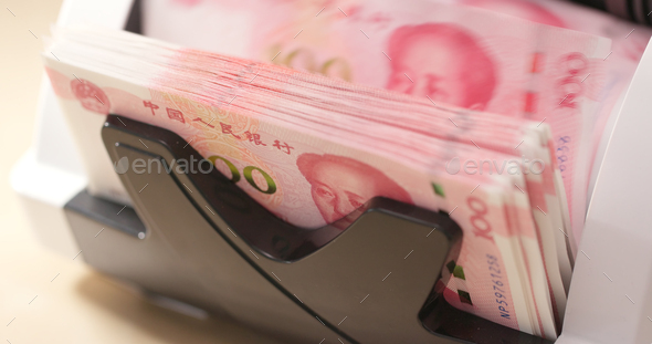 Counting paper banknote machine for RMB Stock Photo by leungchopan