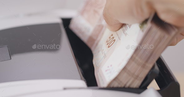 Money counter is counting paper money Stock Photo by leungchopan ...