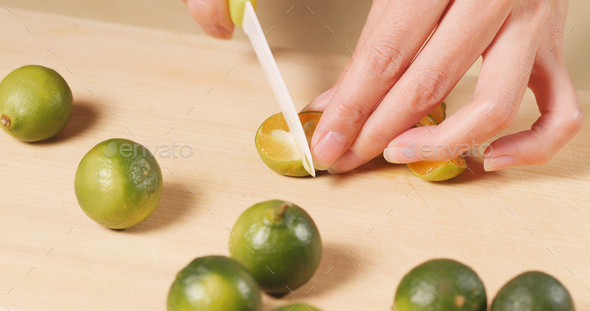 Cutting Citrus for making drink Stock Photo by leungchopan | PhotoDune
