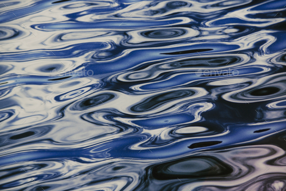 The ocean surface, ripples on the water. Shadow and light reflections ...