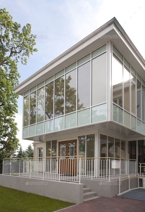 A traditional house with a modern glass extension, two storeys, with ...