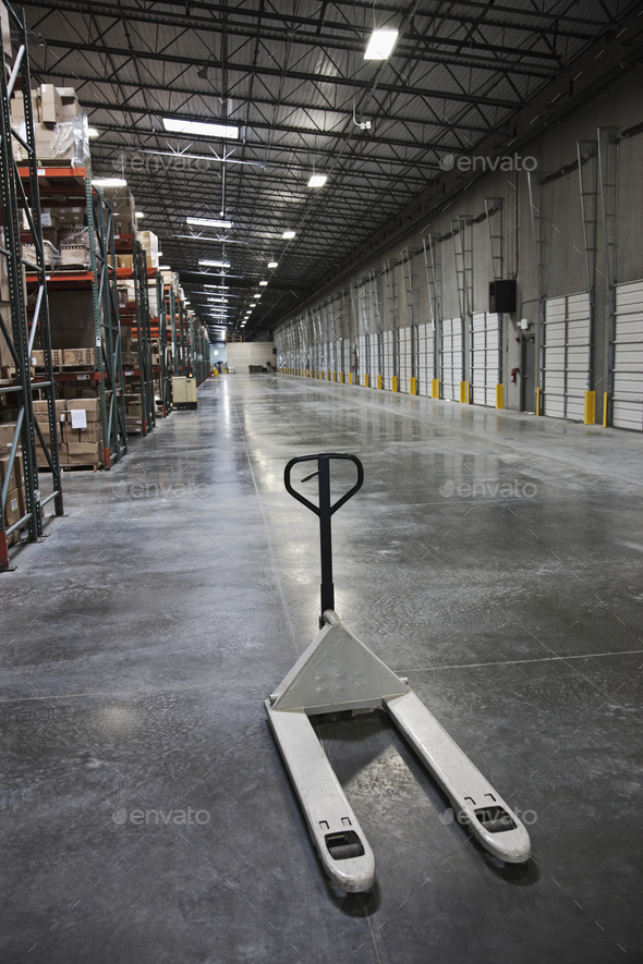 Pallet truck in warehouse Stock Photo by Mint_Images | PhotoDune