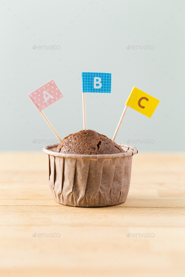 Chocolate muffins with small flag of word ABC Stock Photo by leungchopan
