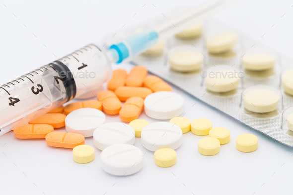 Syringe and tablet drug Stock Photo by leungchopan | PhotoDune