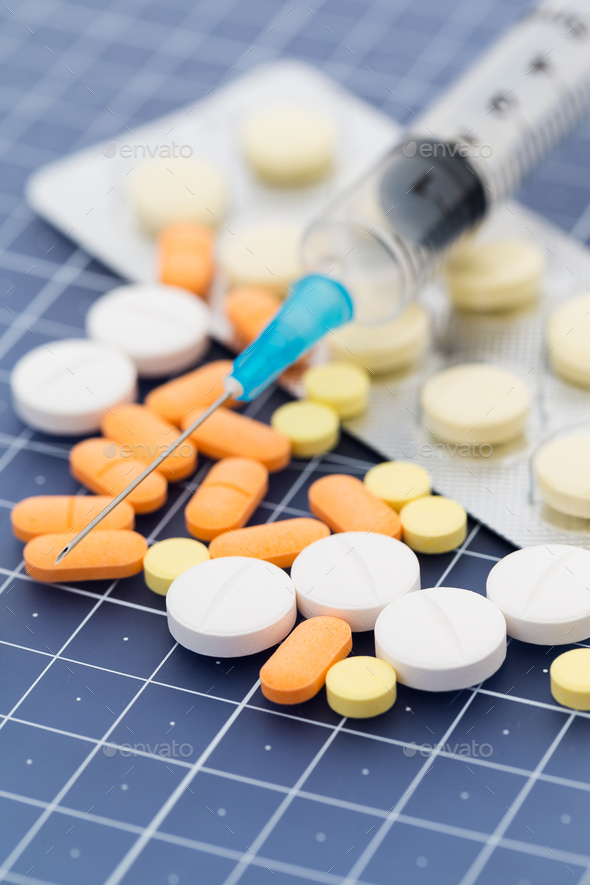 Medical pills and injection syringe Stock Photo by leungchopan | PhotoDune