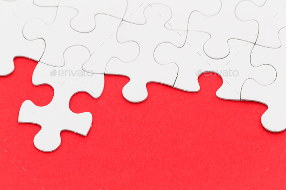 Jigsaw puzzle over red background Stock Photo by leungchopan | PhotoDune