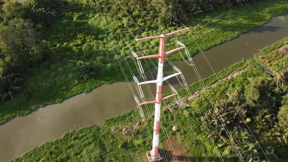 Aerial look down red and white powerline electric tower, Stock Footage