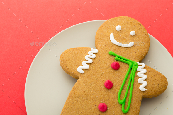 Gingerbread man on red background Stock Photo by leungchopan | PhotoDune