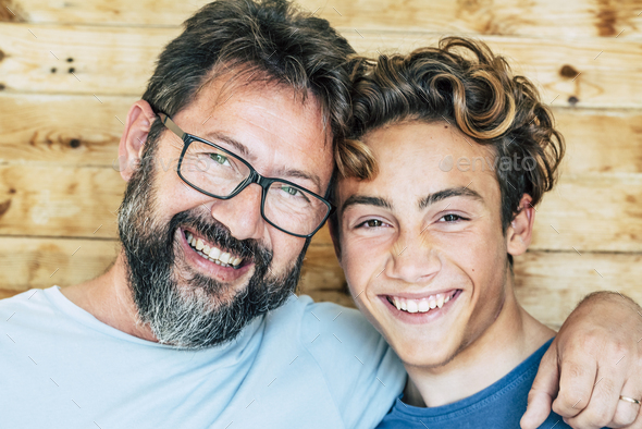 Cheerful people portrait with father and son Stock Photo by simonapilolla