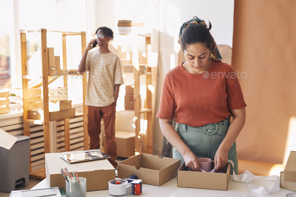 People packing parcels in warehouse Stock Photo by AnnaStills | PhotoDune