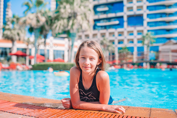 Little adorable girl in outdoor swimming pool Stock Photo by ...