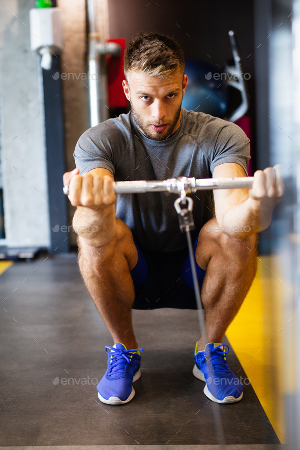Young handsome man doing exercises in gym Stock Photo by nd3000 | PhotoDune